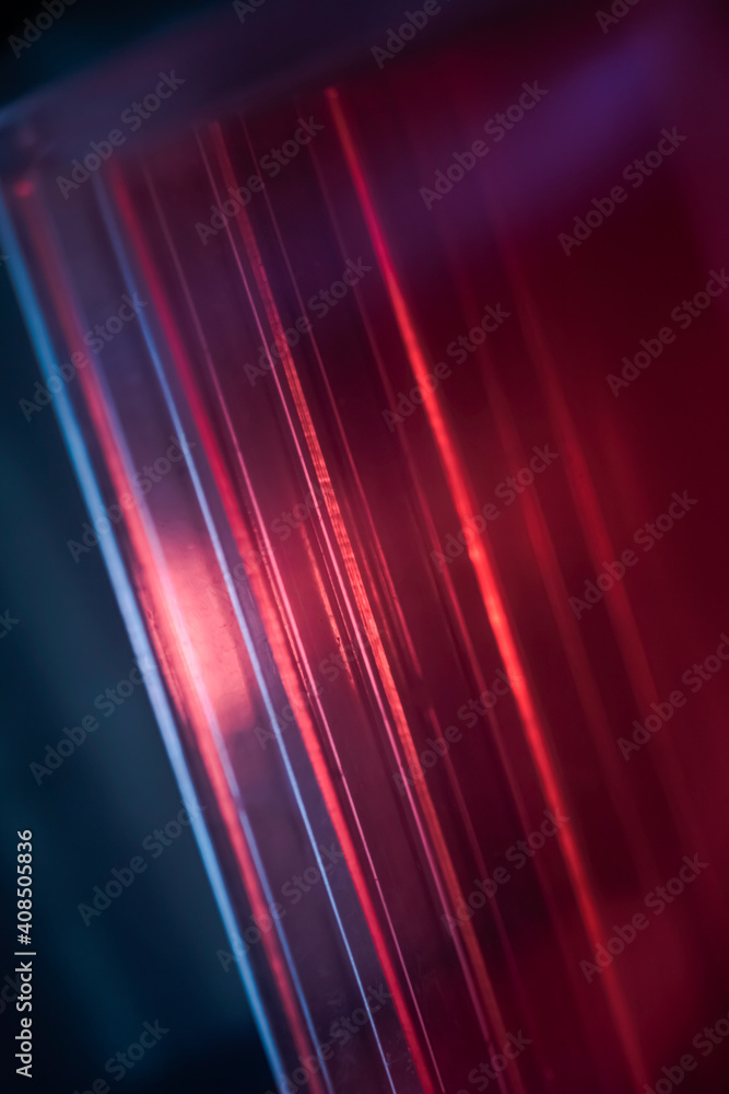 Blurry abstract dynamic futuristic texture of glaring glass sideways ...