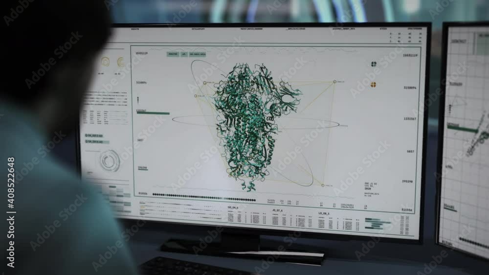 Scientist is looking at a computer screen inside a laboratory. Big ...