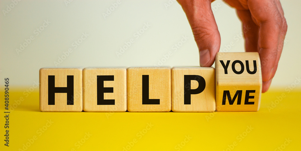 Help you or me symbol. Businessman turns cubes and changes words help ...