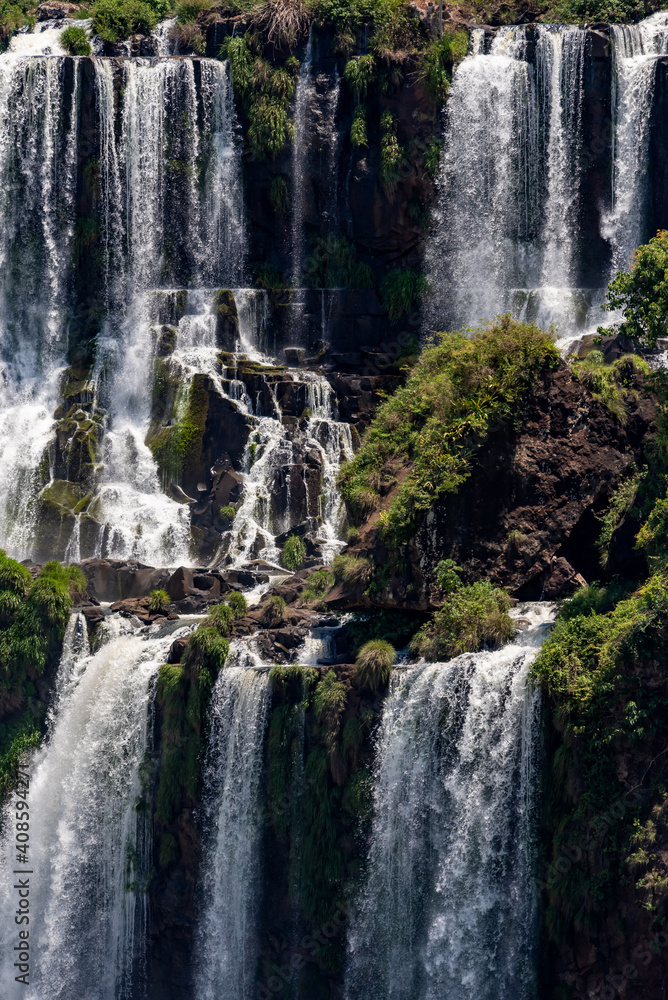 Powerful splashing water stream of famous Iguazu Falls flowing from ...
