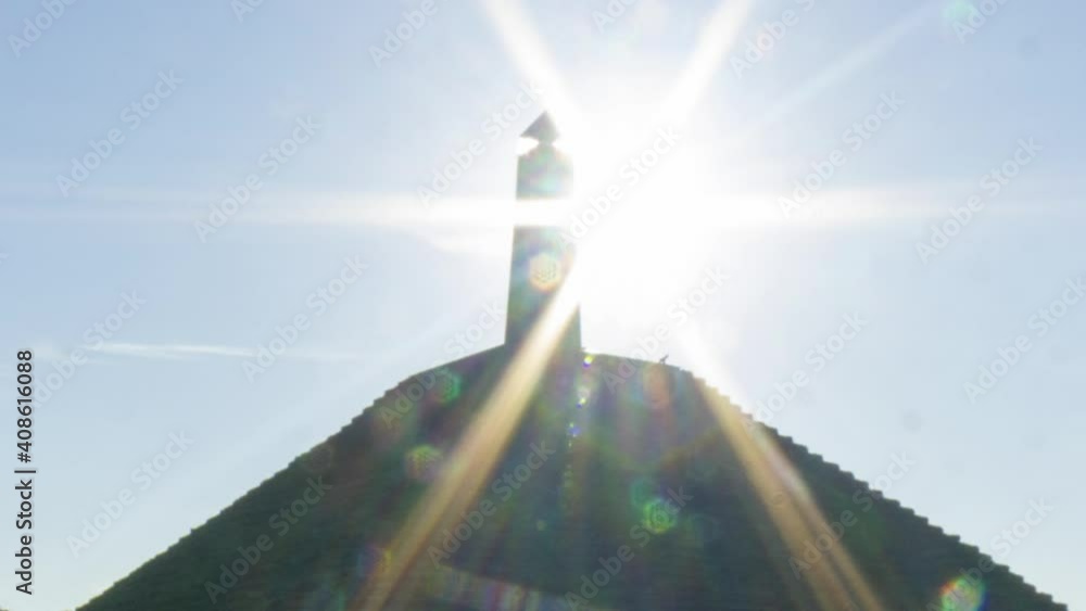 Zoom in - Time lapse of sun appearing behind obelisk on Austerlitz ...