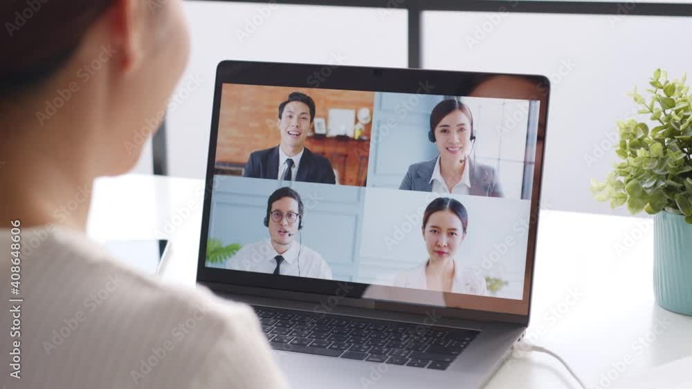 Young Asian businesswoman work at home and virtual video conference ...