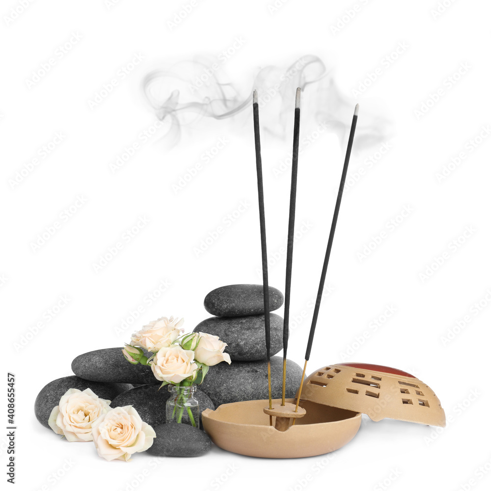 Composition with smoldering incense sticks, roses and spa stones on ...