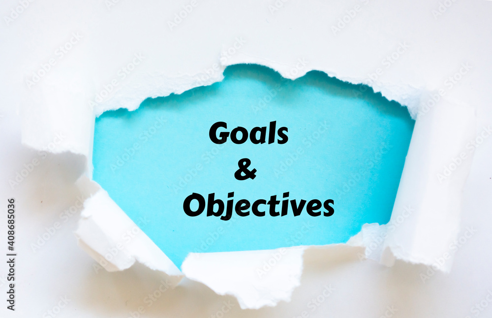 Goals and Objectives words written under torn paper. Stock Photo ...