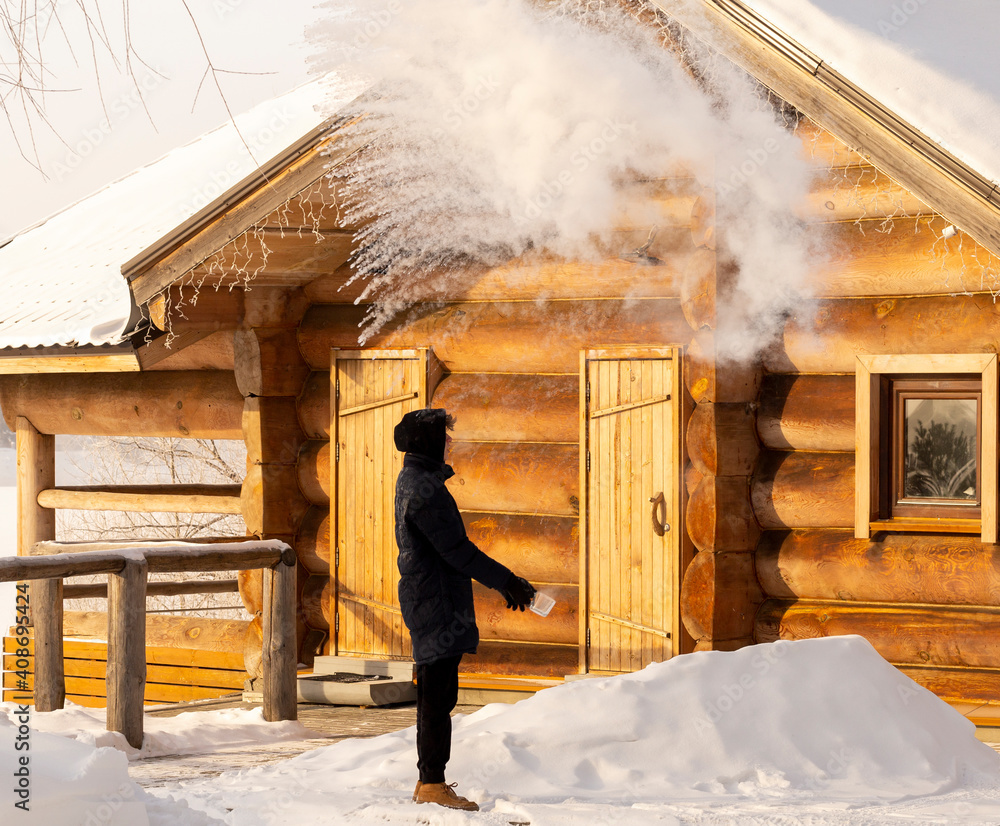 boiling water splashed out of a mug in the cold minus 35 degrees turns ...