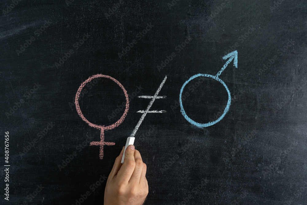 Gender inequality concept drawing on chalk board. Hand crosses out ...