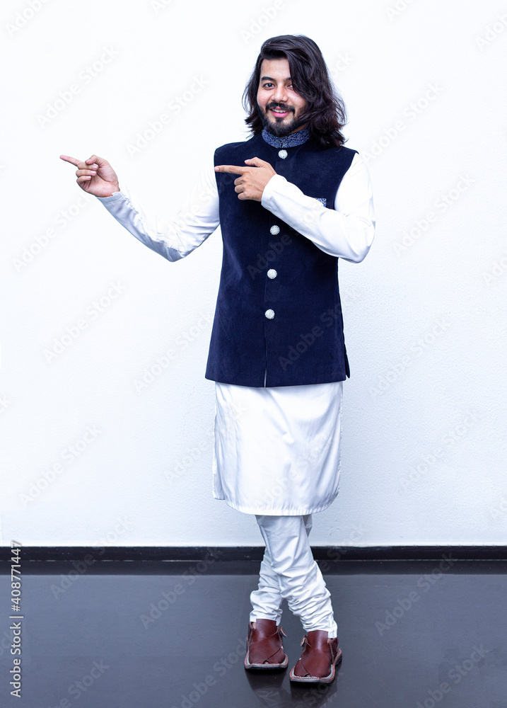 Pakistani Man Pointing with both hands fingers at right side with corse ...