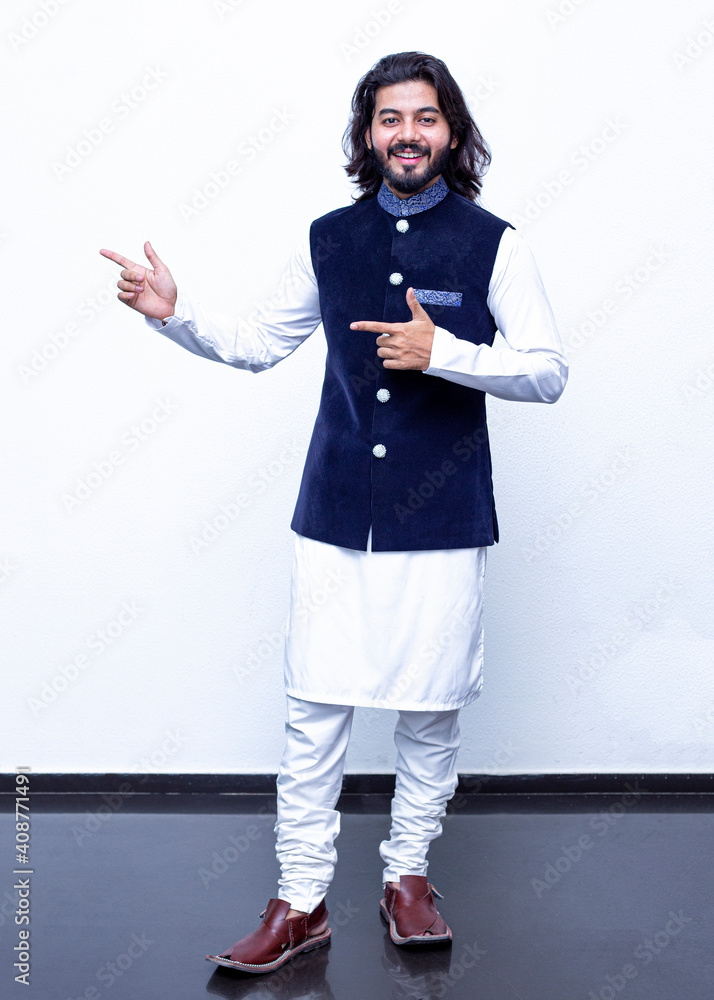 Pakistani Man Pointing with both hands fingers at right side with corse ...