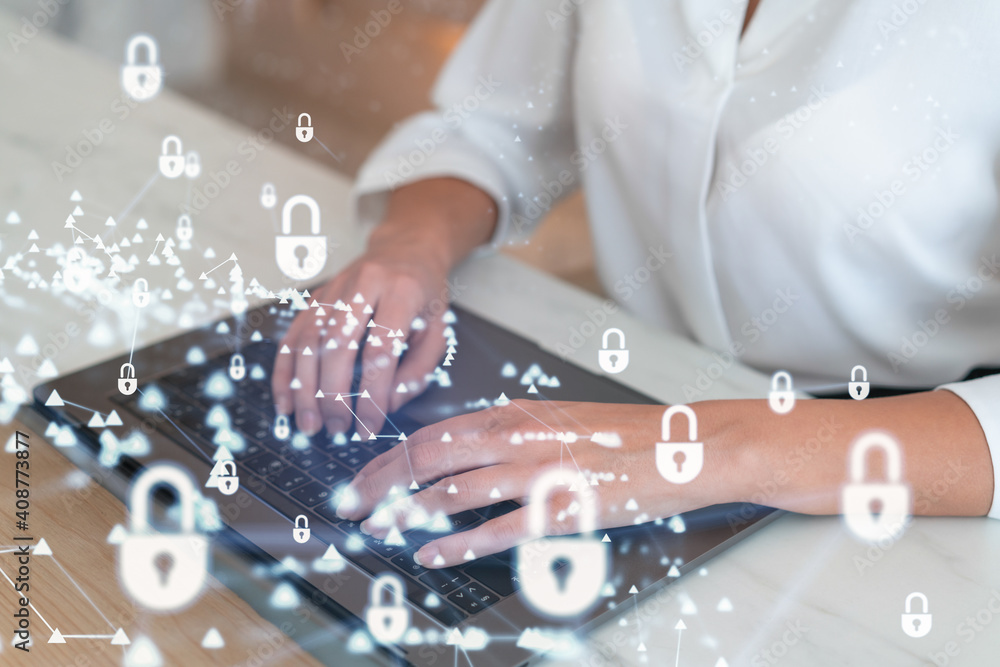A woman programmer is typing a code on computer to protect a cyber ...