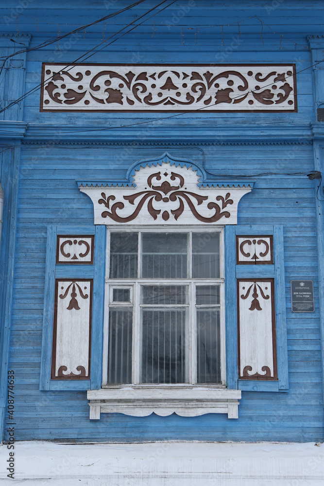 Ornamental window with carved frame on vintage wooden rural house in ...
