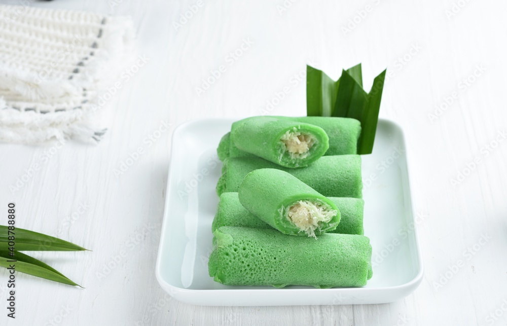 dadar gulung or ketayap is an traditional sweet snack ,popular in ...