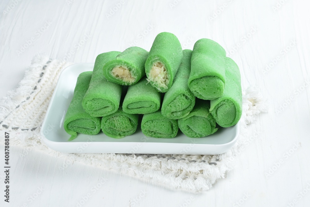 dadar gulung or ketayap is an traditional sweet snack ,popular in ...
