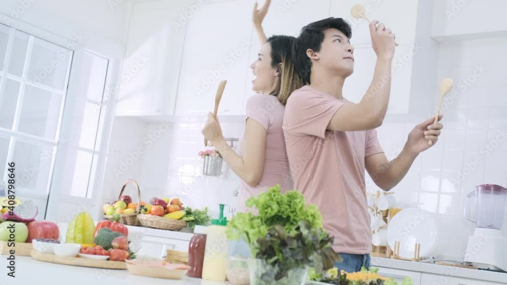 Happy playful millennial asian family couple having fun together in ...