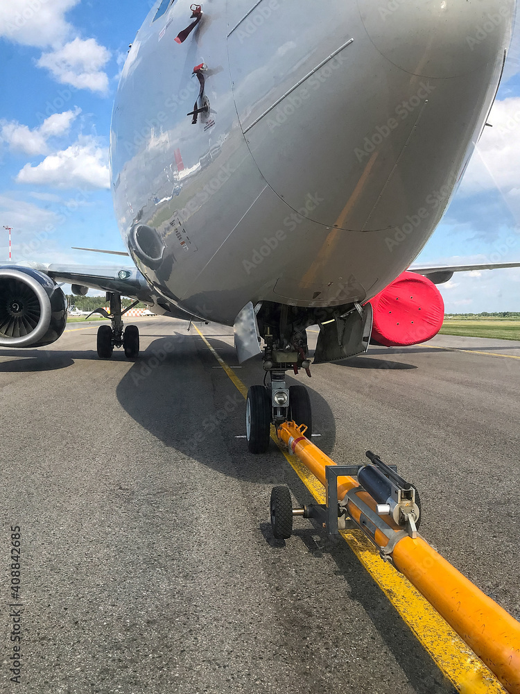 Transporting a large aircraft from a parking lot on the tarmac prior to ...