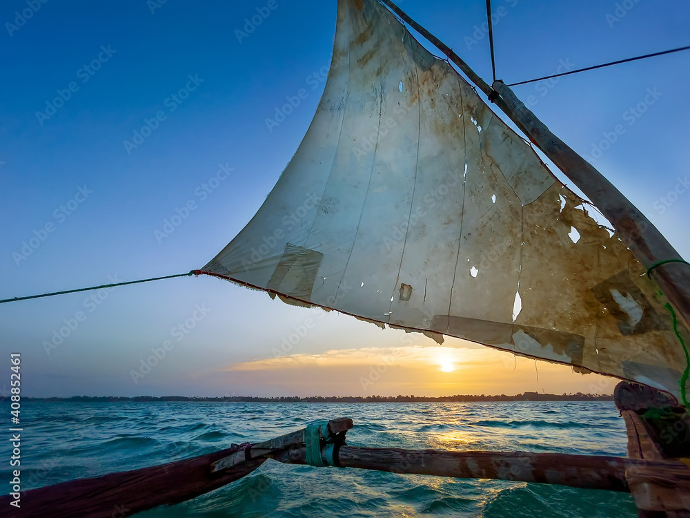 Old traditional maritime traditional vessel Dhow boat sailing under ...
