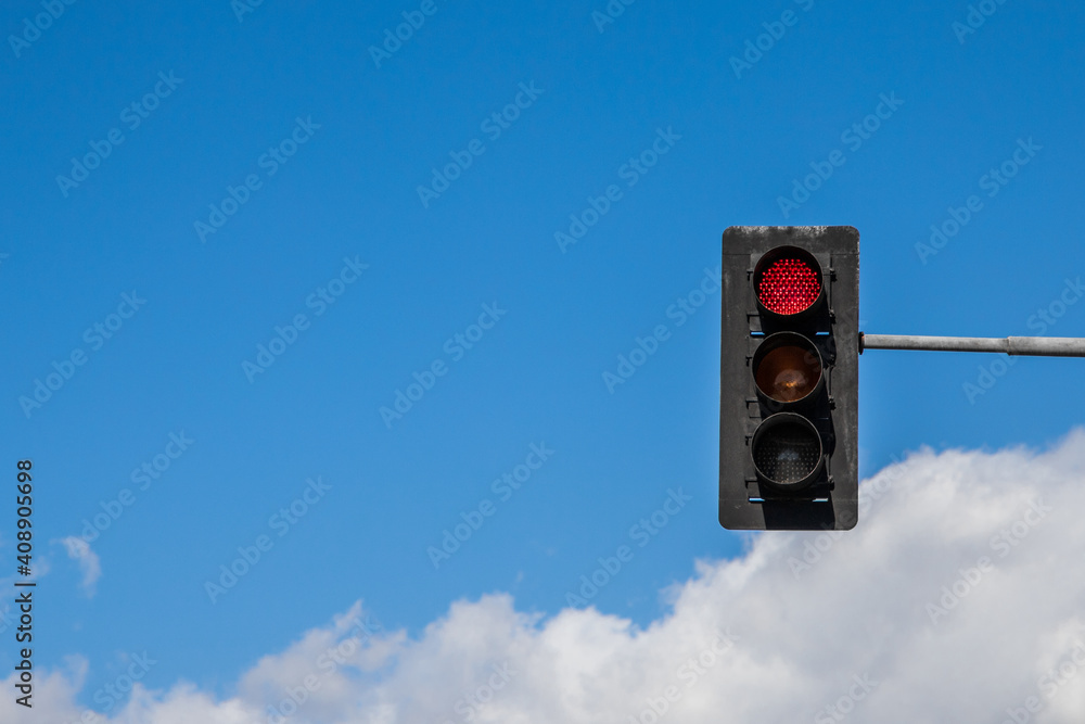 red traffic light on sky Stock Photo | Adobe Stock