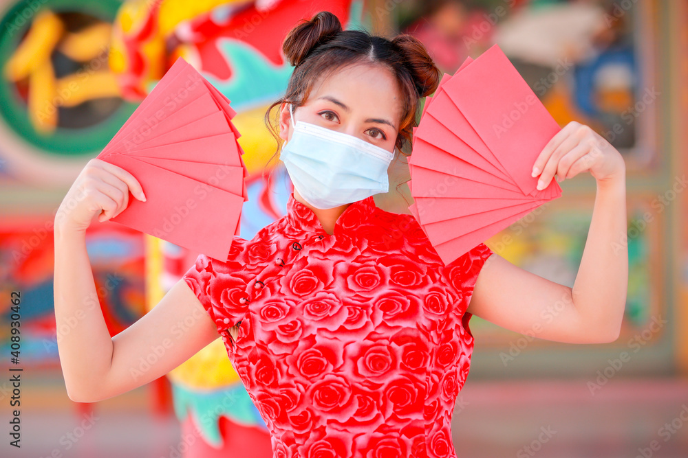 Beautiful gorgeous Asian woman in traditional Chinese dress holding Ang ...