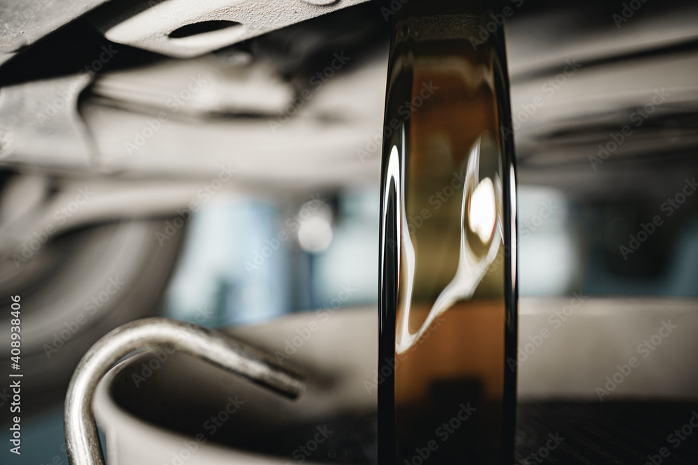 Old oil pouring from the car engine Stock Photo | Adobe Stock