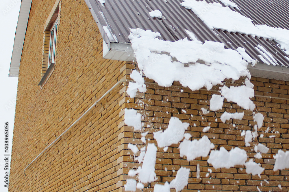 Snow falls from the roof of the house. Close-up. Background. Stock ...