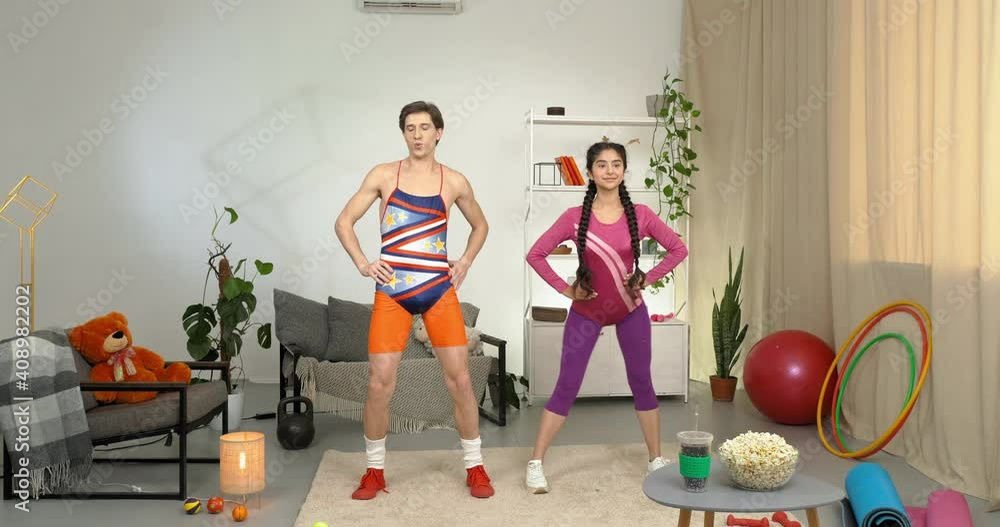 Funny retro sportsman athletes wear sports suit from 80s train at home ...