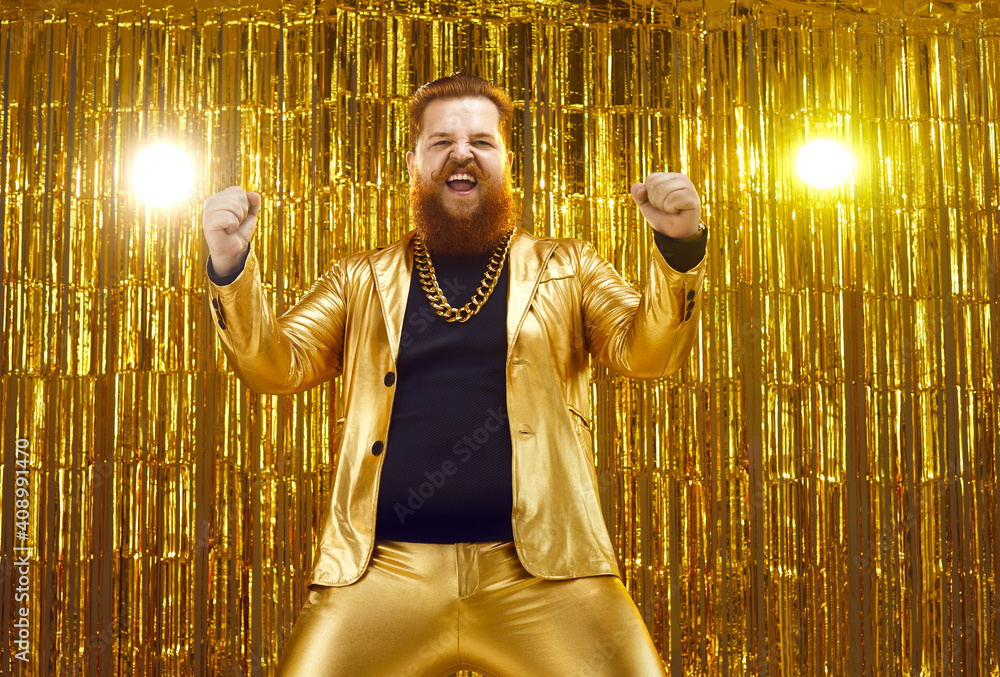 Happy crazy funky uninhibited ginger young man wearing funny golden ...