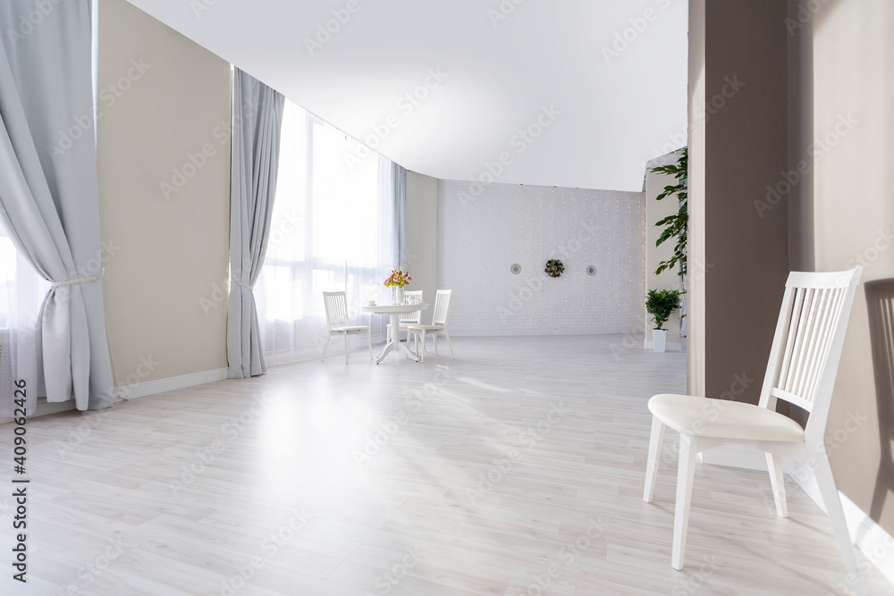 Luxurious and expensive interior of an open-plan apartment in light ...