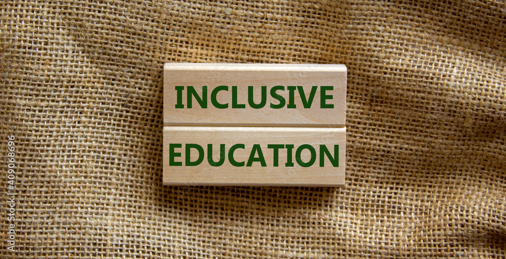 Inclusive education symbol. Wooden blocks form the words 'inclusive ...