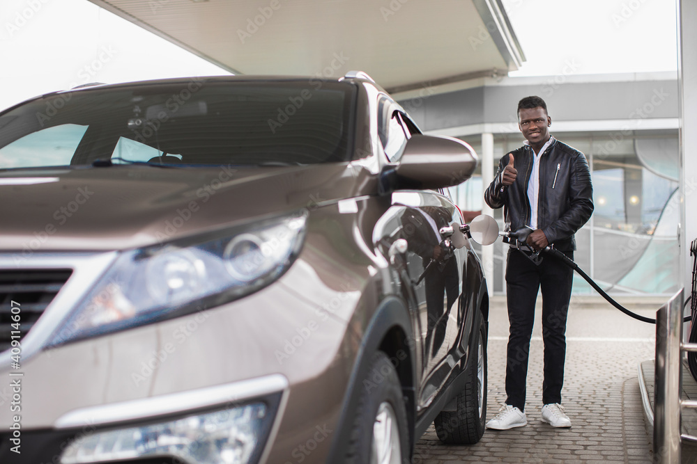 Happy bearded African man gesturing thumb up and smiling while ...