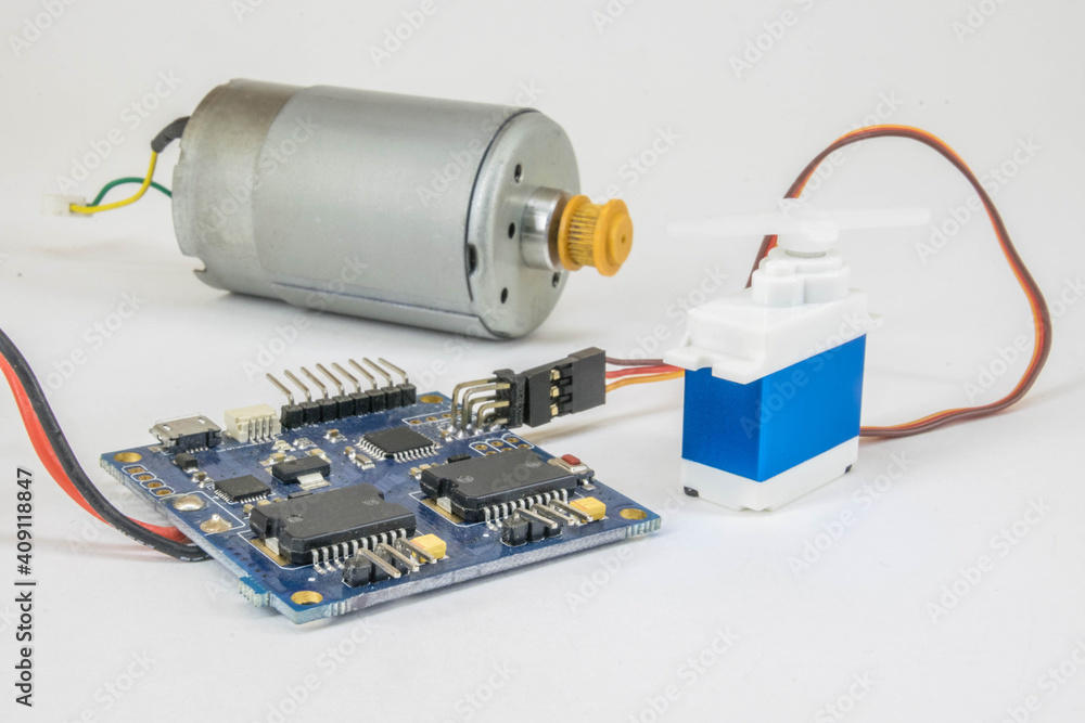 electric motor connected to an electronic control board and a servo ...
