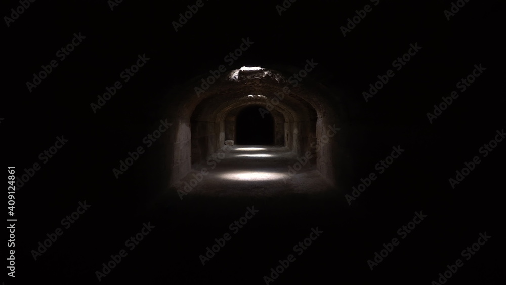 Pass through a long and dark Roman basement. Basement under the ...