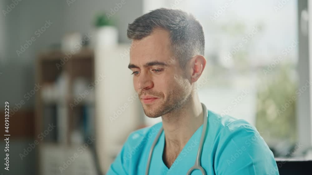 Portrait of Experienced Male Nurse Wearing Blue Uniform Smiling at ...