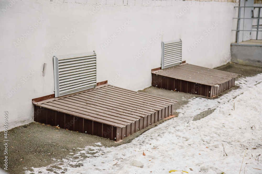 Ventilation shafts and entrance to the basement of an apartment ...