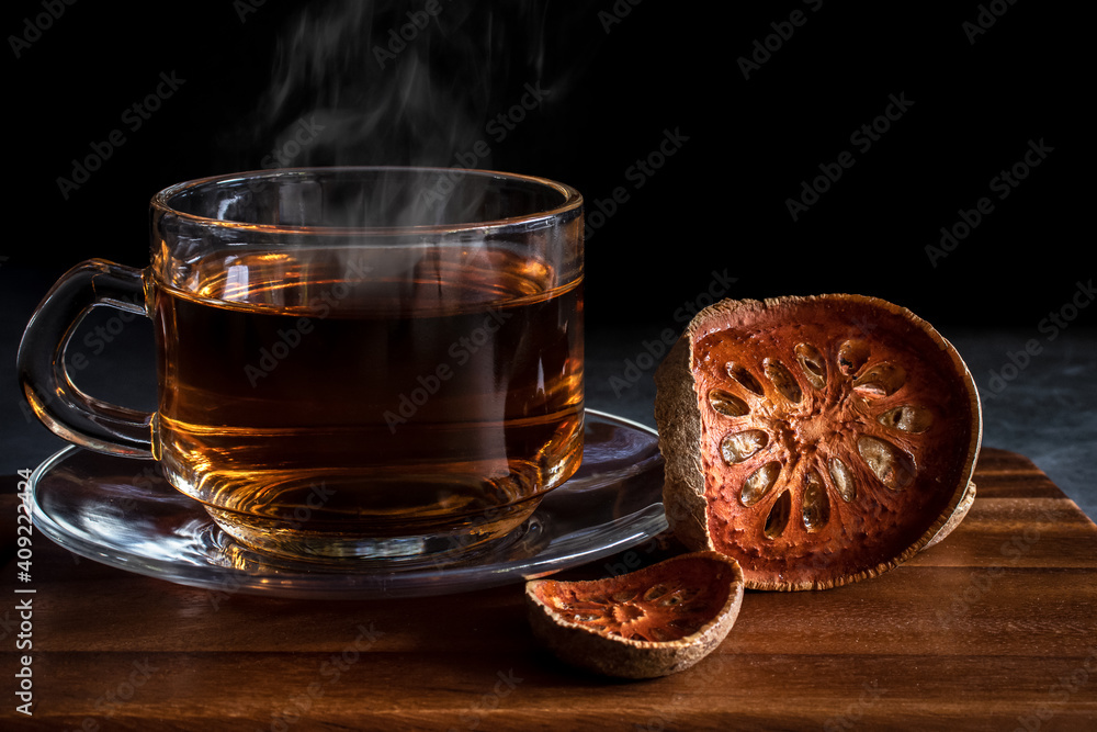 Matum tea. Bael fruit tea and slices of dried bael fruit Stock Photo ...