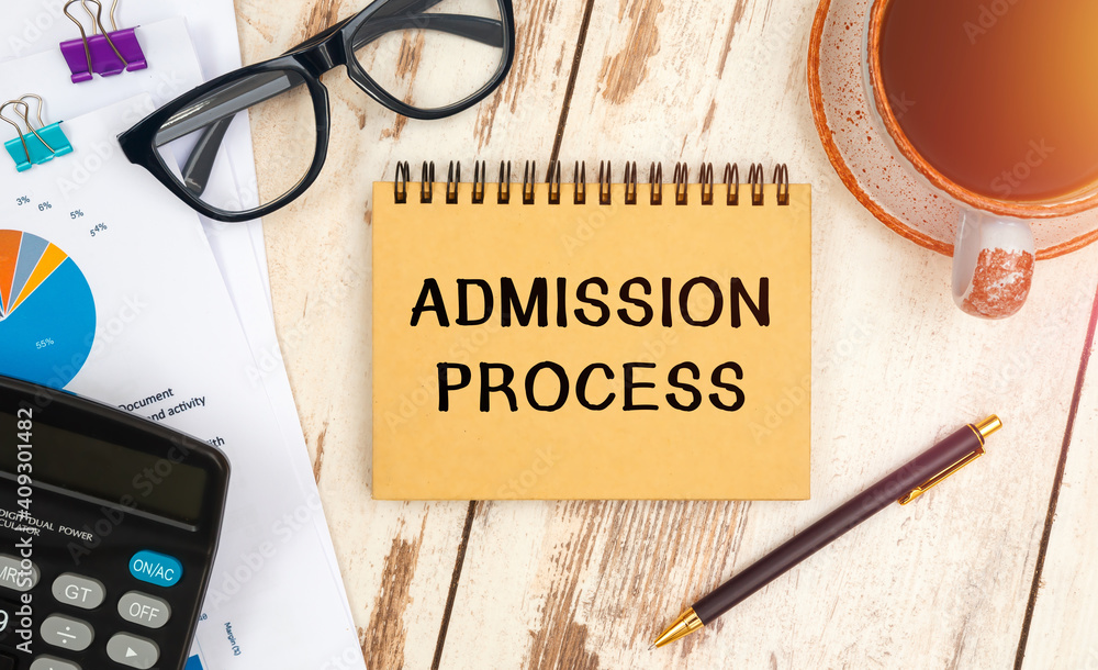 ADMISSION PROCESS is written on a notepad on an office desk Stock Photo ...