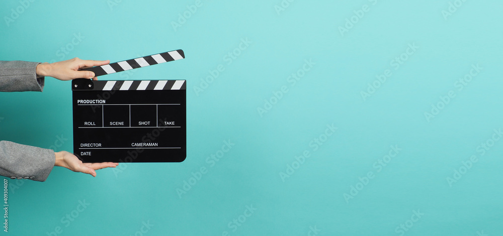 Black Clapperboard or movie Clapper board for videography with hands in ...