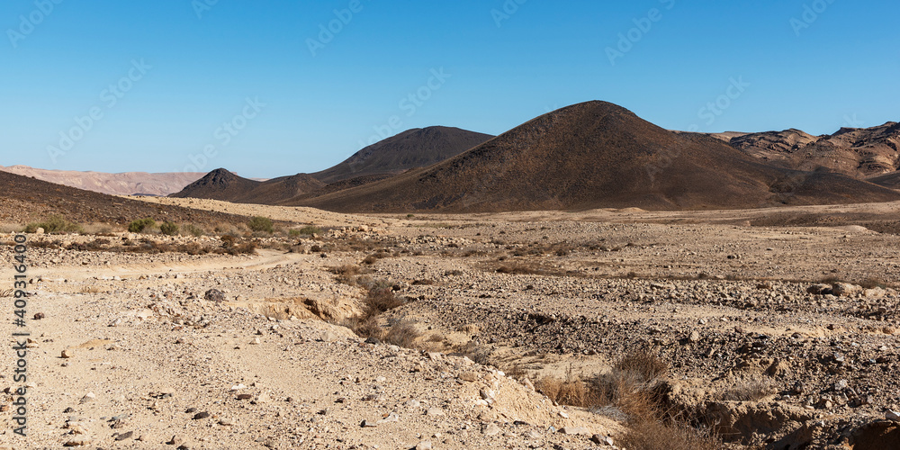 basalt hills that are remnants of ancient volcanoes rise above the ...