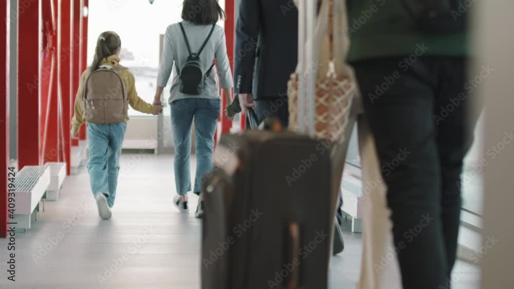 Back-view slow-motion footage of passengers boarding on airplane ...