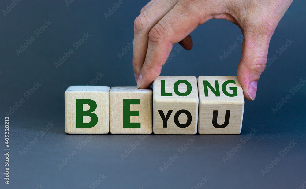 Be you, belong symbol. Businessman hand turns cubes and changes words ...