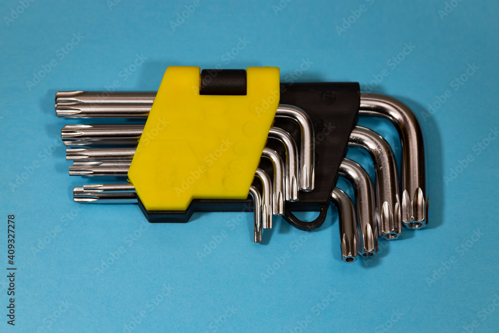 Torx Key Set Arc. Kit of silver coloured Torx keys. Blue background ...