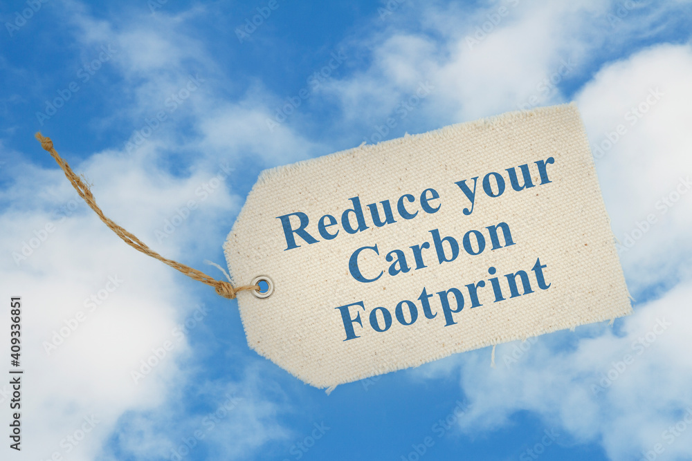 Reduce your carbon footprint message on blue sky Stock Photo | Adobe Stock