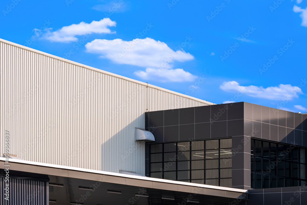 Low angle and side view of brown office on white corrugated metal ...