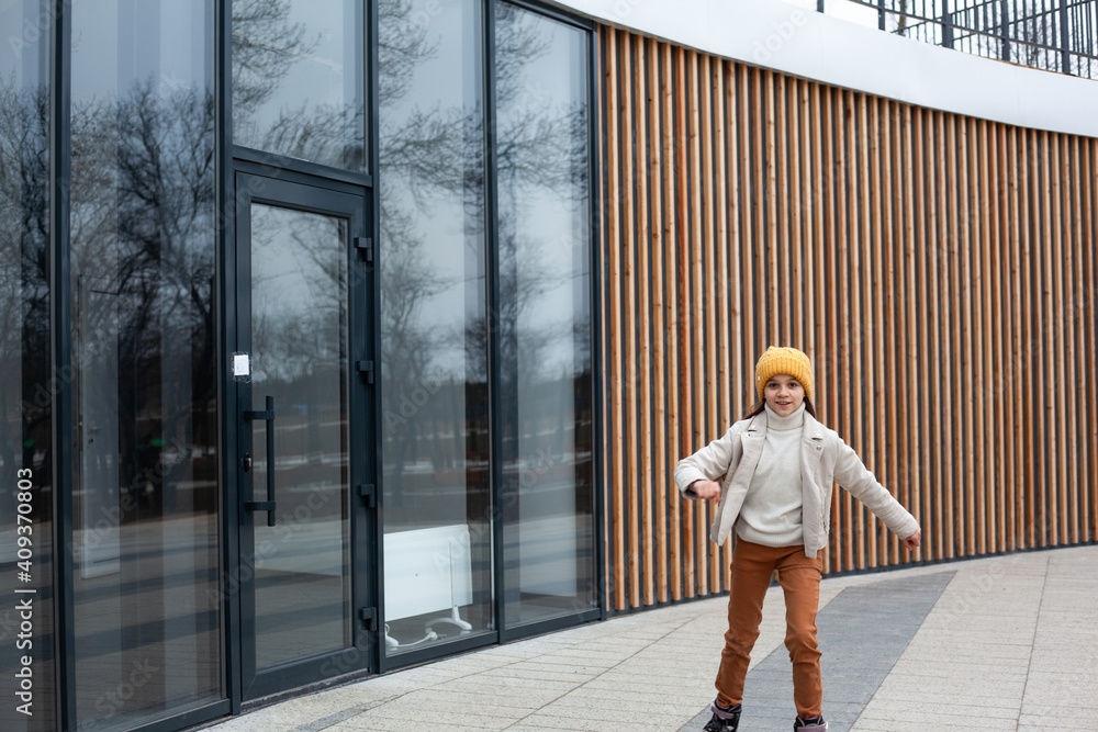 Preteen girl roller scating in the park after school. Rest time for the ...