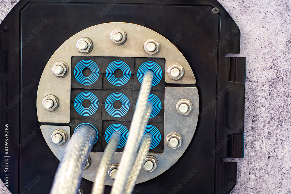 Wires are fixed to wall with a protective adapter. Adapter with fire ...