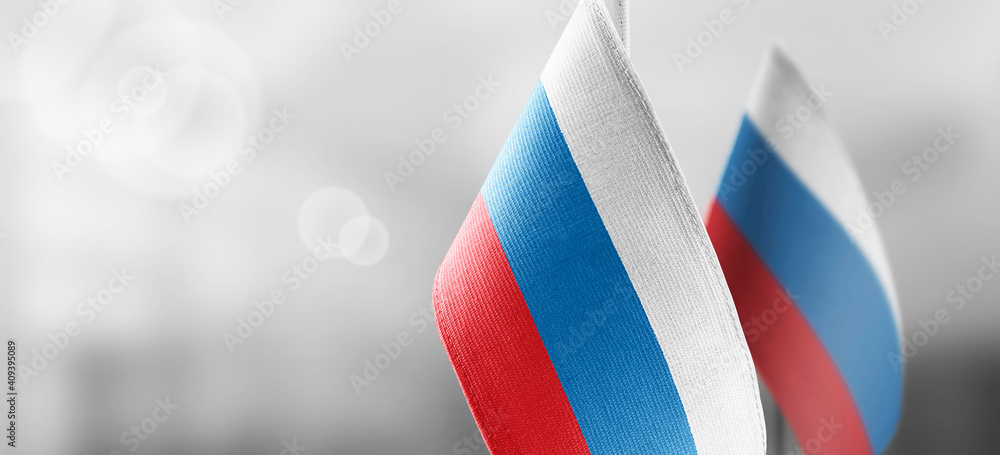 Small national flags of the Russia on a light blurry background Stock ...