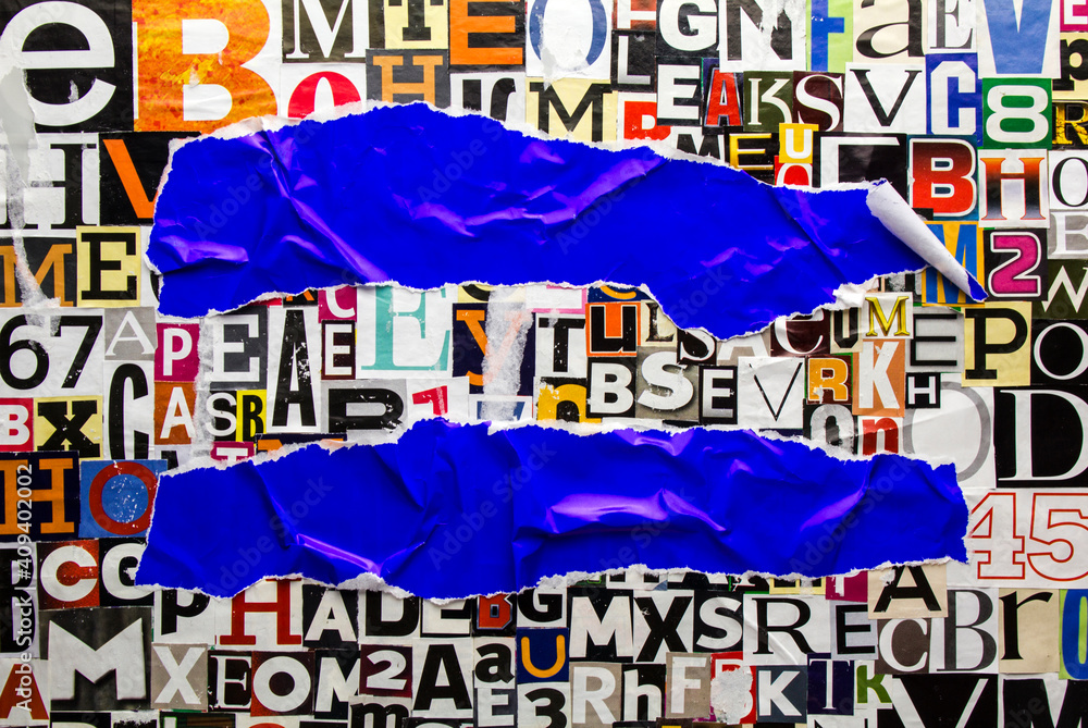 Torn and crumpled piece of blue paper on collage from clippings with ...