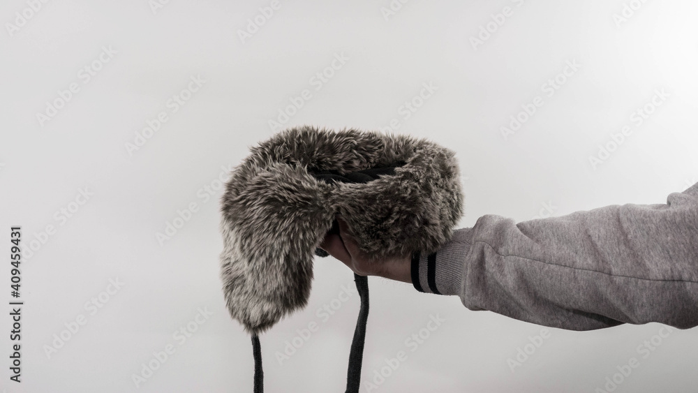 Holding hat in hand begging on a white background, place to insert the ...