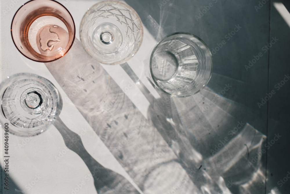 Crystal glasses for wine in the sunshine, with light passing through ...