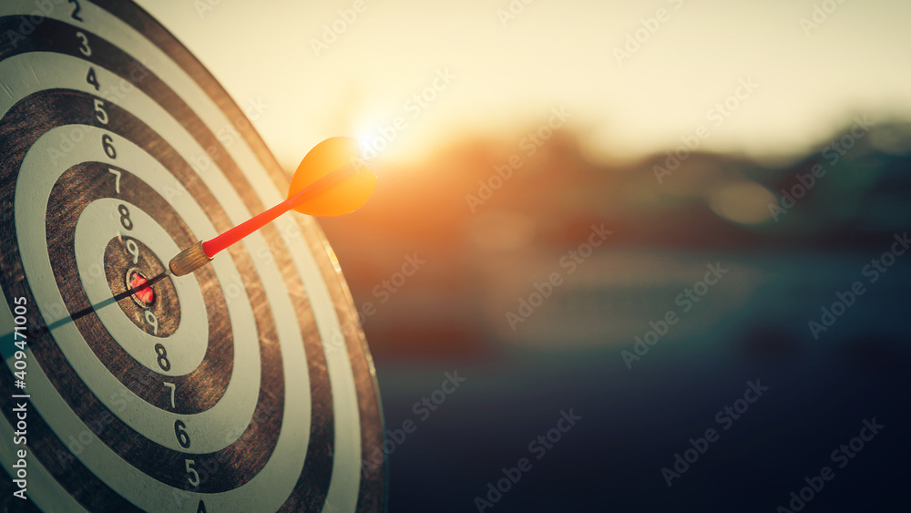 bullseye target or dart board has red dart arrow throw hitting the ...