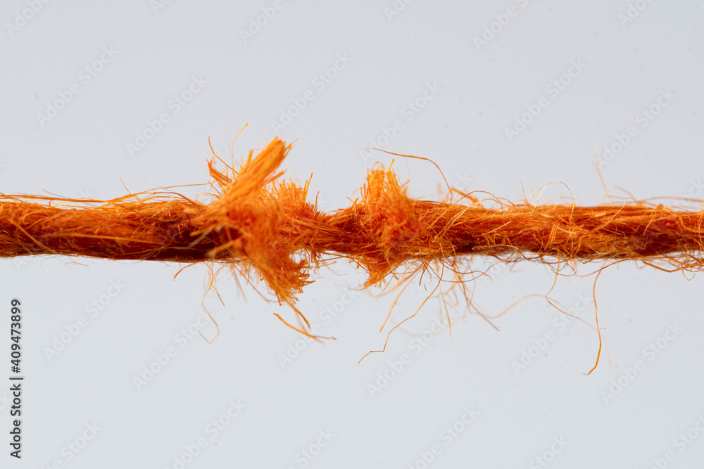 Tear test of a red thread closeup Stock Photo | Adobe Stock