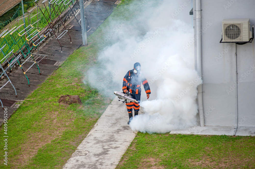 Healthcare worker using Fogging machine spraying chemical to eliminate ...